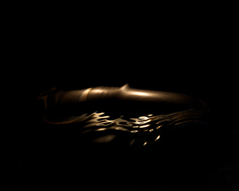 Gold Halo Morphing Its Shape Within Rippling Water Surreal Movement ...